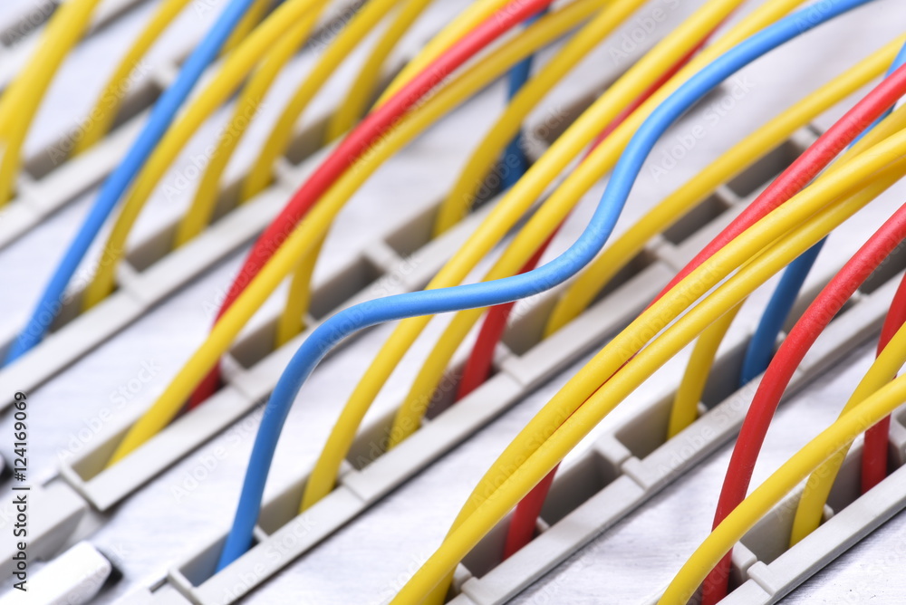 Telecommunication main distribution frame with colorful cables, close ...