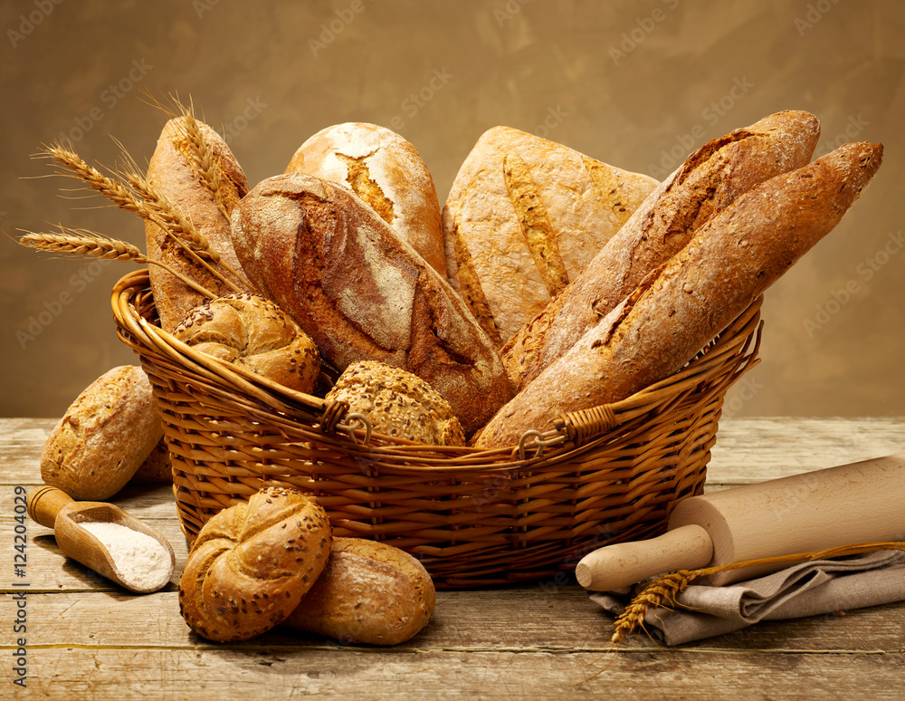 Different bread types in a basket Stock Photo | Adobe Stock