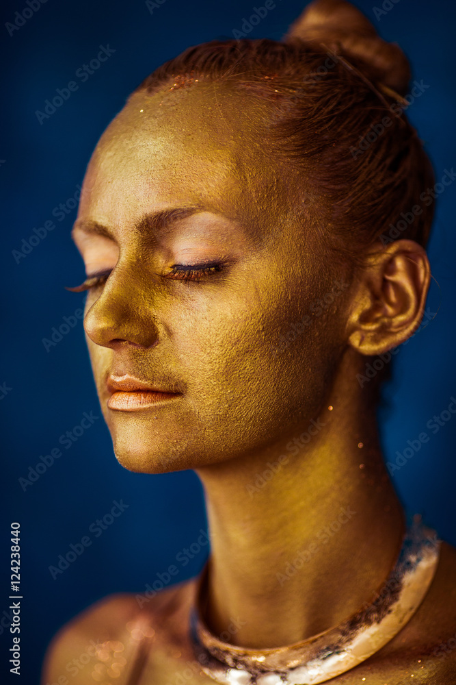 Portrait of golden woman's face Stock Photo | Adobe Stock