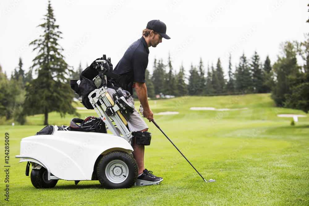 Disabled golfer in a tournament using high tech mobility aid; Edmonton ...