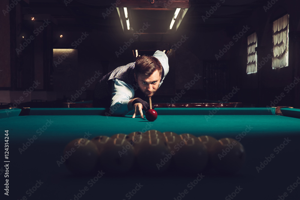 Man playing billiard Stock Photo | Adobe Stock