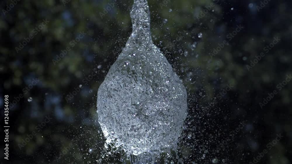 Shot breaking water filled blue balloon, slow motion Stock Video ...