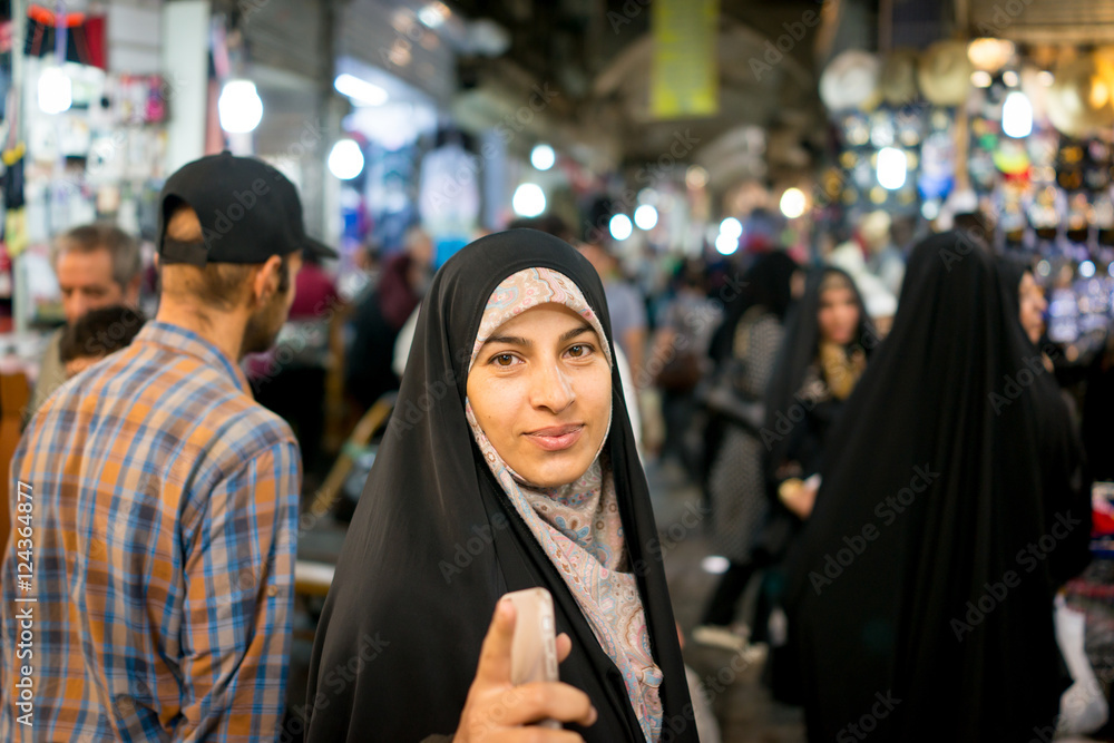 Beautiful Muslim woman spending time on traditional Iranian baza Stock ...
