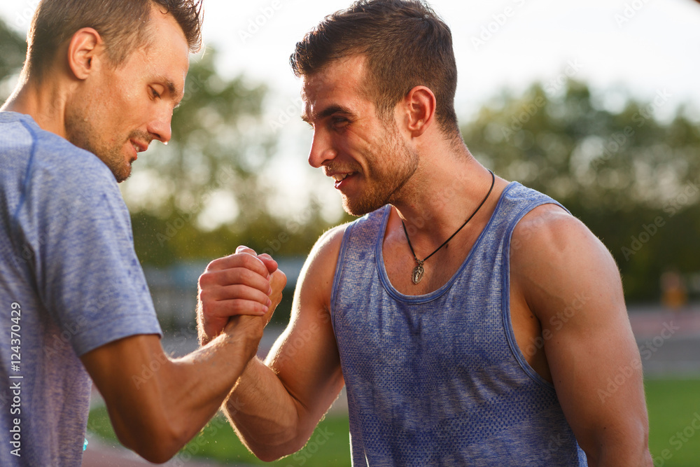 Two strong handsome man greet each other during workout Stock Photo ...