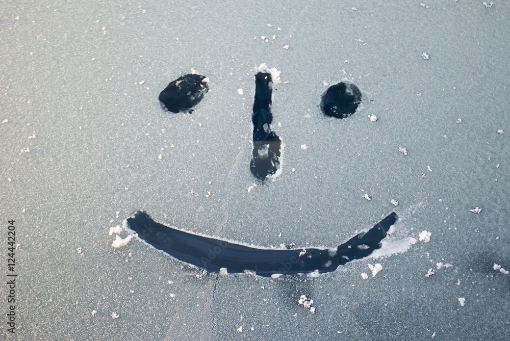 Emoticon/ Smiley face drawn on a frozen glass Stock Photo | Adobe Stock