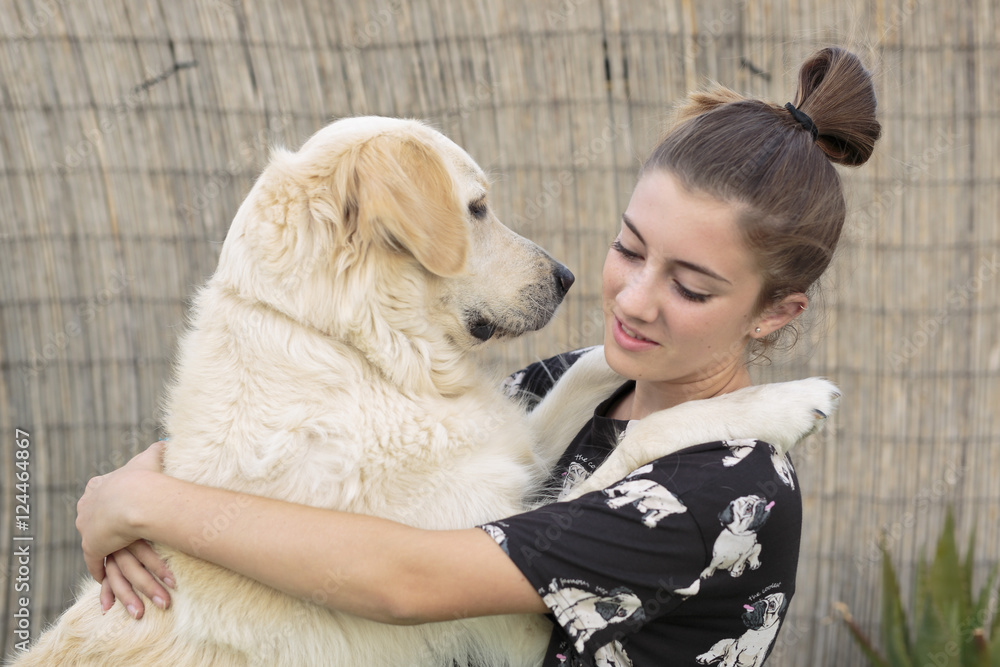 Dog breed Golden Retriever giving a hug to his owner. Take horizontal ...