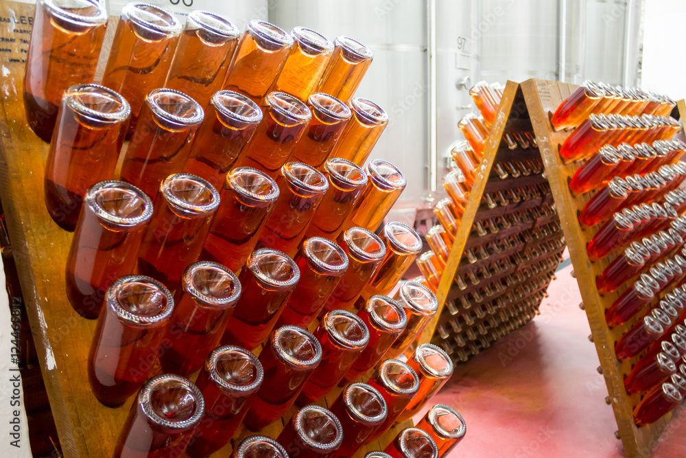 Champagne bottles turned upside down maturing in cellar Stock Photo ...