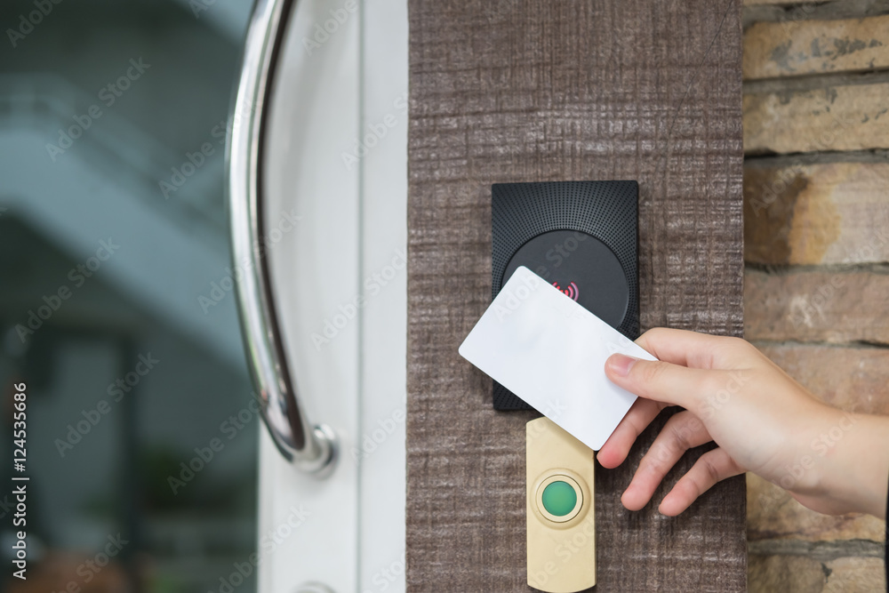Door access control with a hand inserting key card to lock and u Stock ...