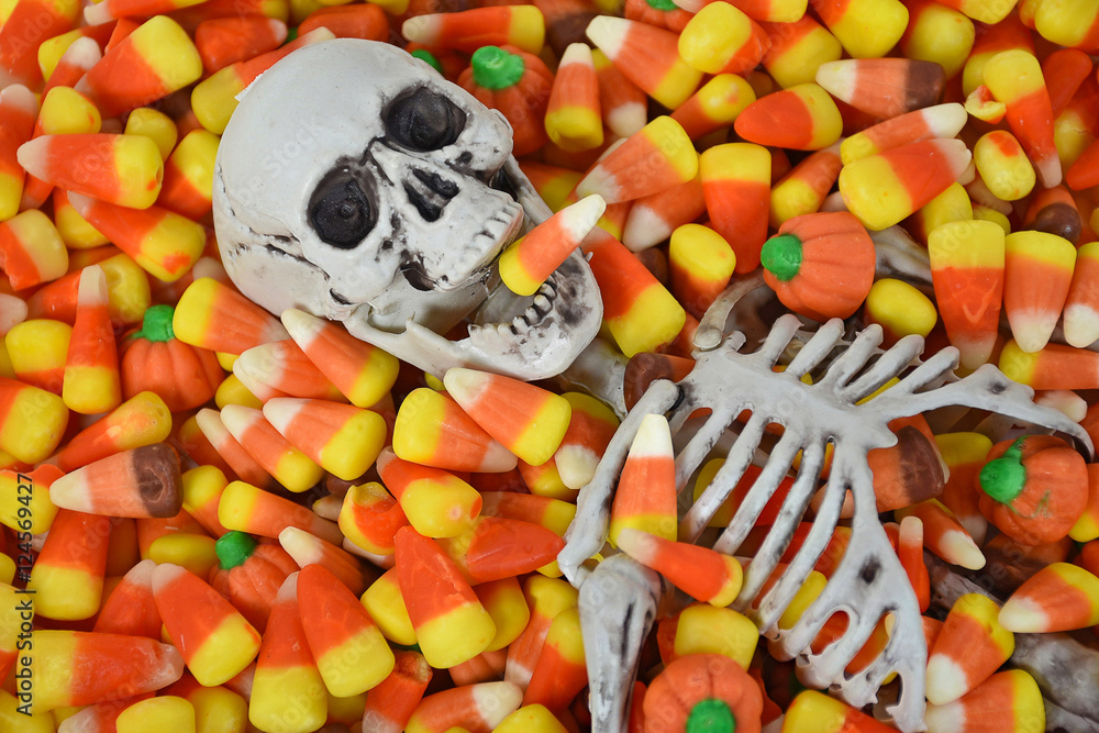 Foto de Halloween skeleton in candy corn do Stock | Adobe Stock