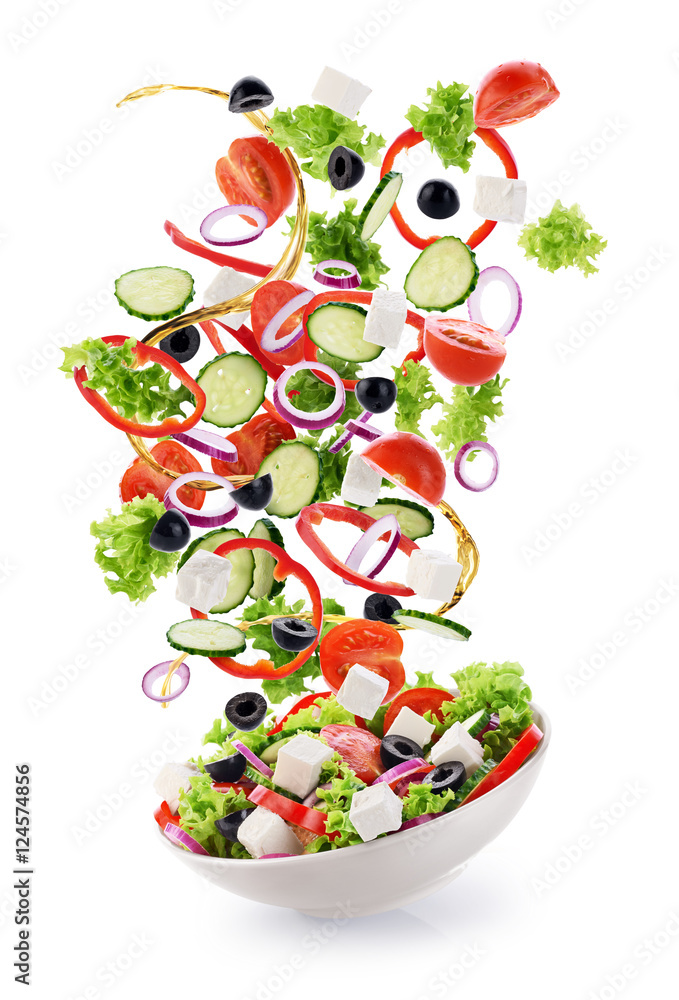 Flying salad ingredients isolated on white background. Stock Photo ...
