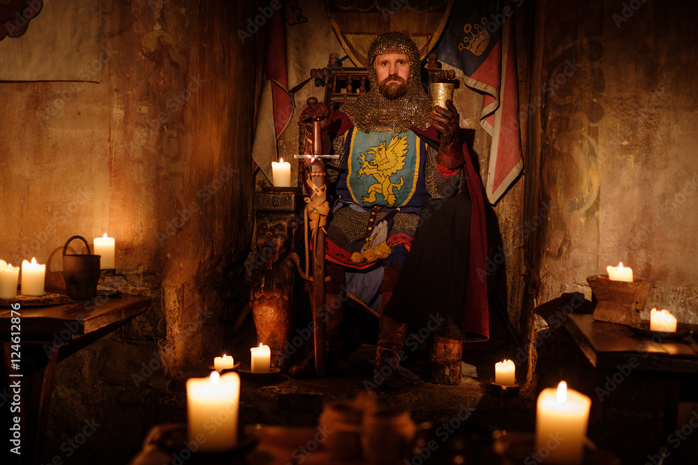 Medieval king on throne in ancient castle interior. Stock Photo | Adobe ...