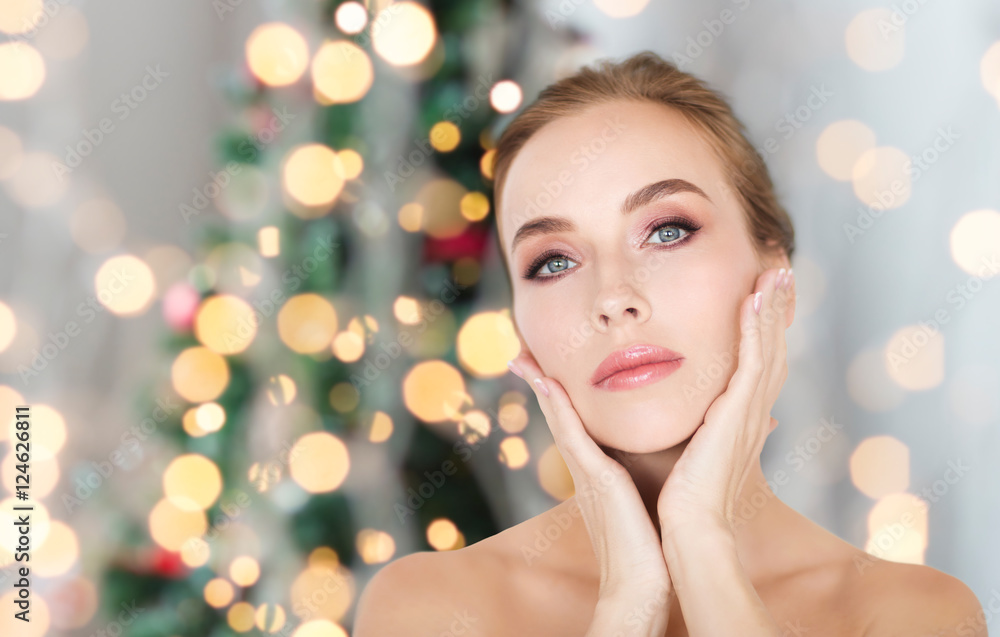 beautiful woman face over christmas lights Stock Photo | Adobe Stock