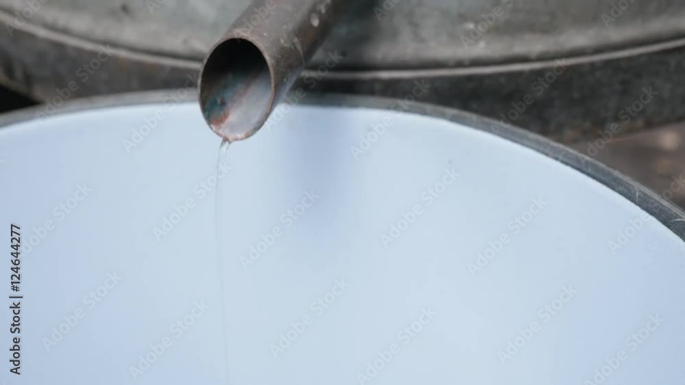 Serbian rakija alcohol drips from boiler drum into beaker 4K 2160p ...