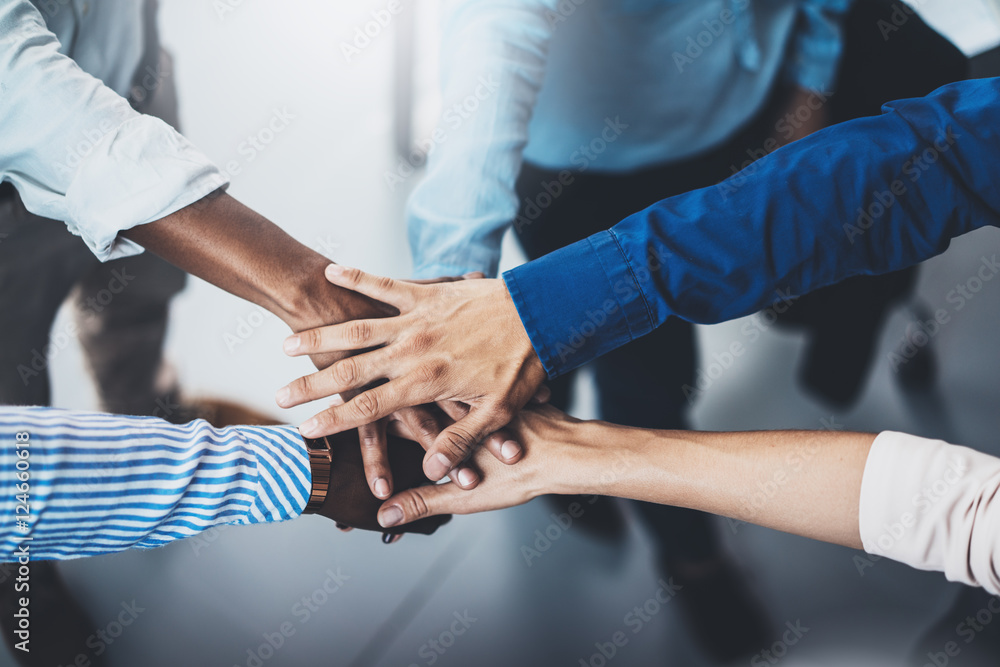 Concept of teamwork.International business team showing unity with ...