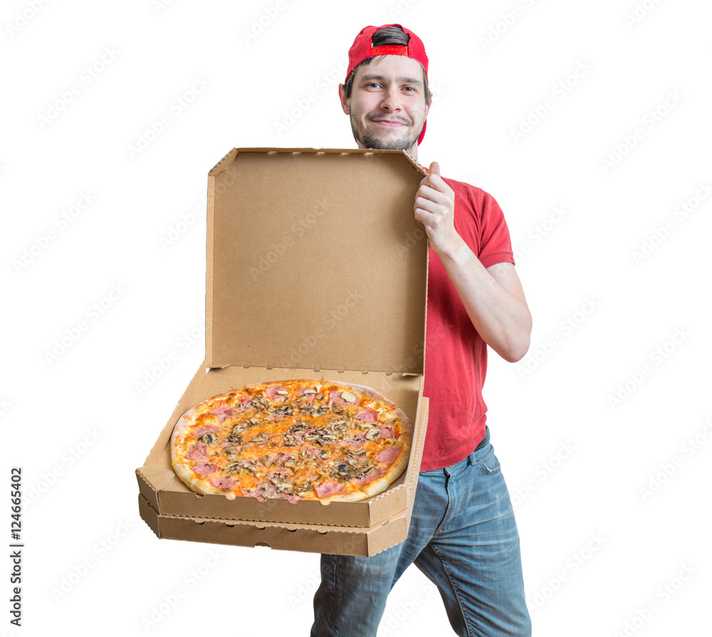 Pizza delivery concept. Young smiling guy is delivering tasty pizza ...