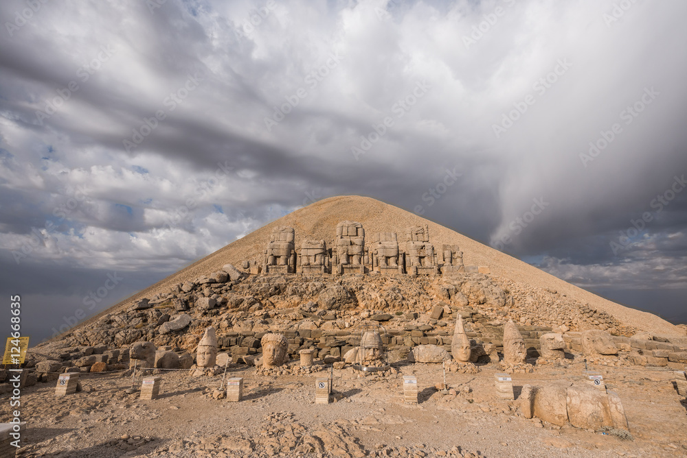 Mount Nemrut at sunrise with the head in front of the statues. The ...