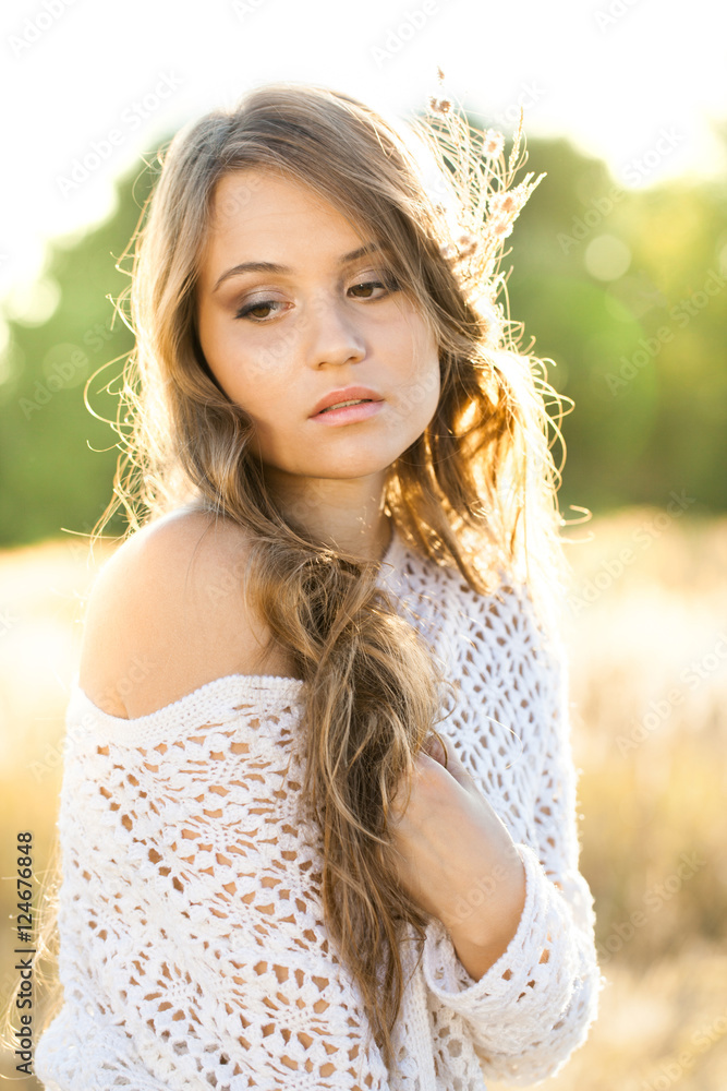 Beautiful lady model in an open field at sunrise Stock Photo | Adobe Stock