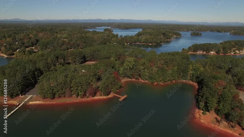 Aerial footage of lake houses in South Carolina and majestic mountains ...