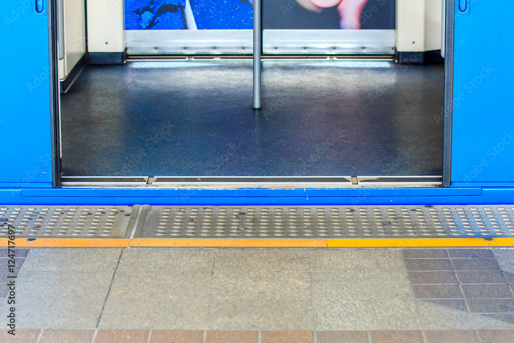 opened sliding mechanical door of a Bangkok Skytrain at a BTS train ...