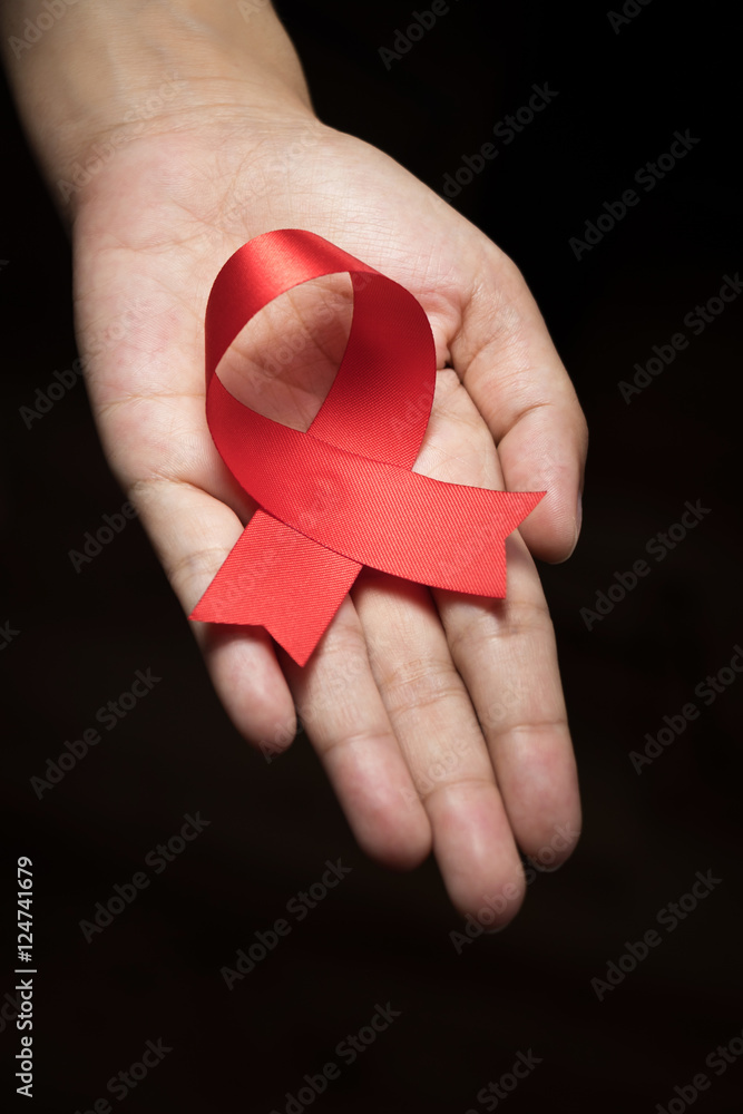 Red ribbon awareness on woman human hand : World aids day satin ribbon ...