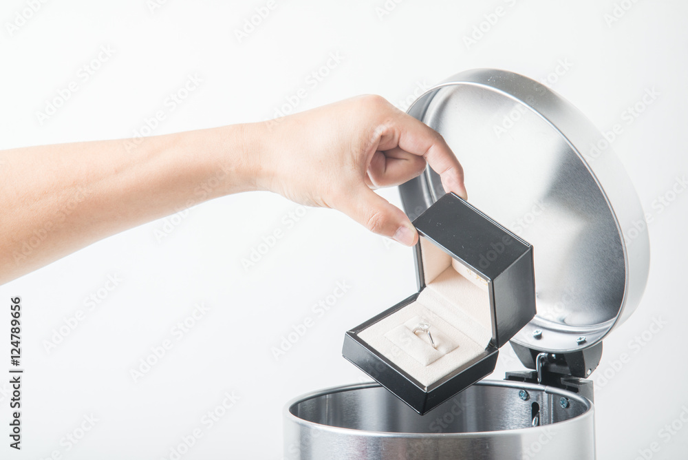 throwing away diamond ring in trashcan Stock Photo | Adobe Stock