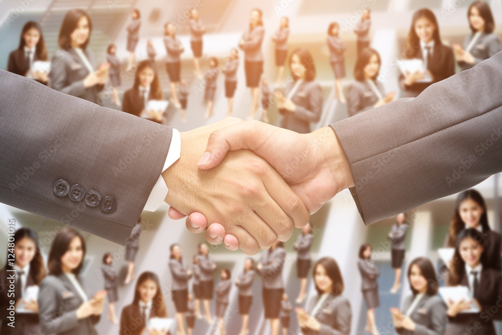 Businessmen shaking hands,business and office concept,Working women ...