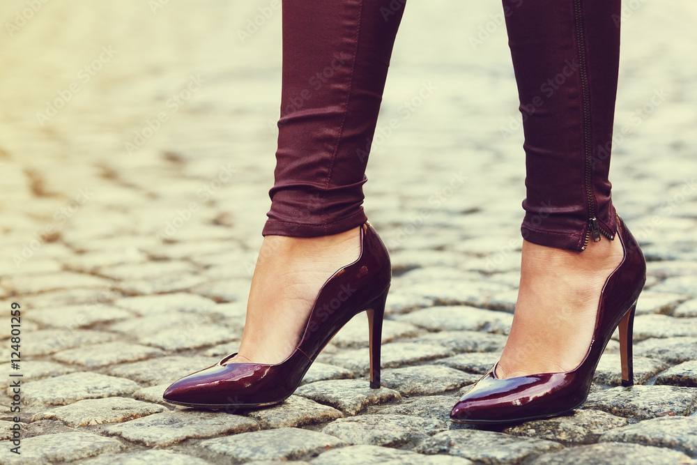 Woman wearing classic high heel toe shoes. Model posing on the street ...
