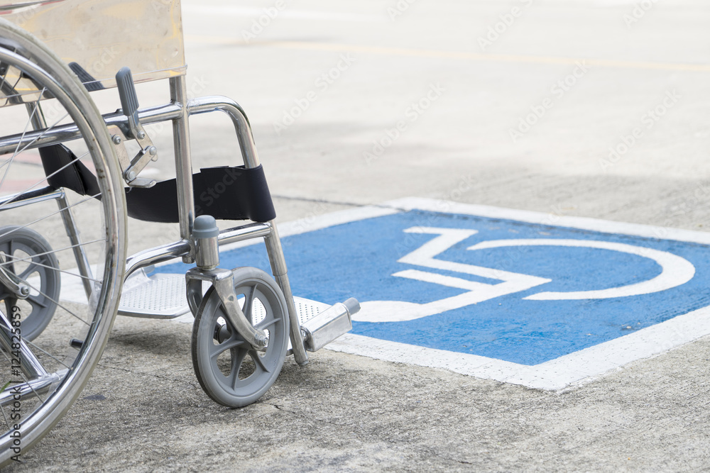 Pavement handicap symbol and wheelchair Stock Photo | Adobe Stock