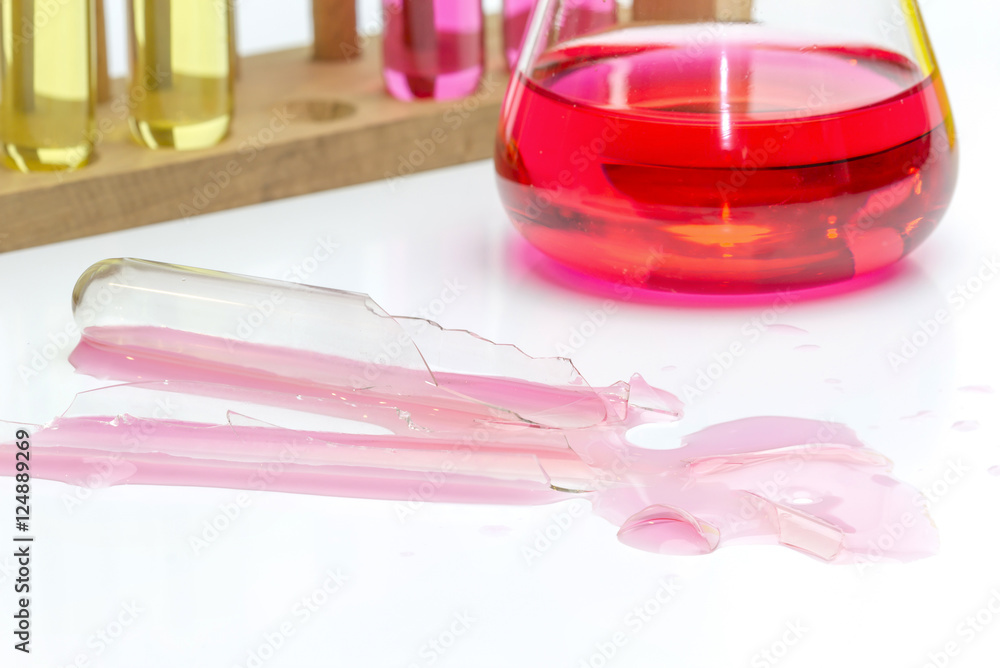 liquid chemical spilled from laboratory glassware Stock Photo | Adobe Stock