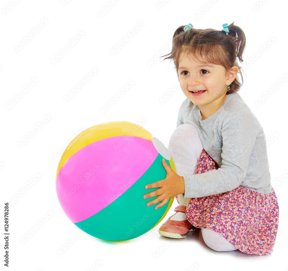 Little girl hugging a big ball Stock Photo | Adobe Stock