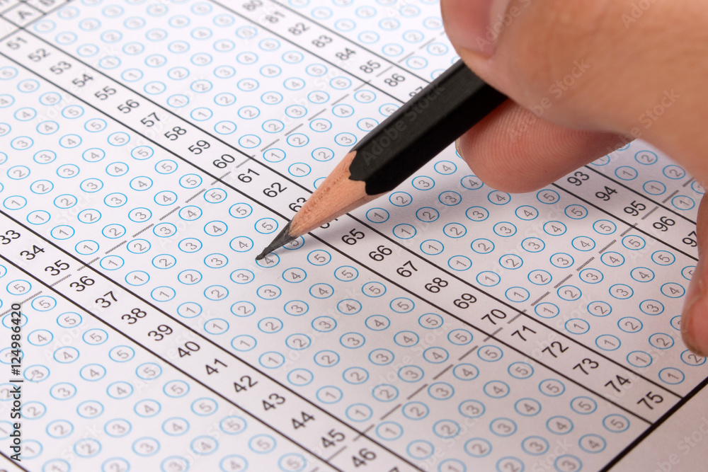 Filling out in answer sheet. Answer sheet focus on pencil. Bubble ...