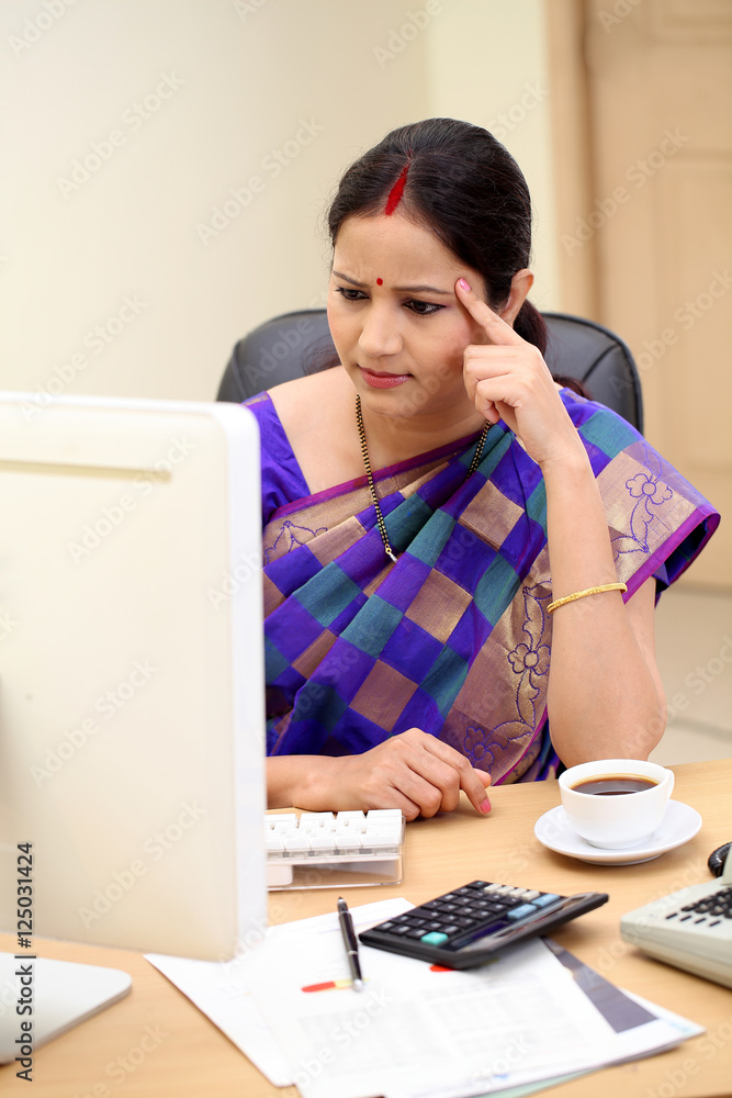 Happy traditional Indian business woman at office desk Stock Photo ... Happy traditional Indian business woman at office desk Stock Photo ...