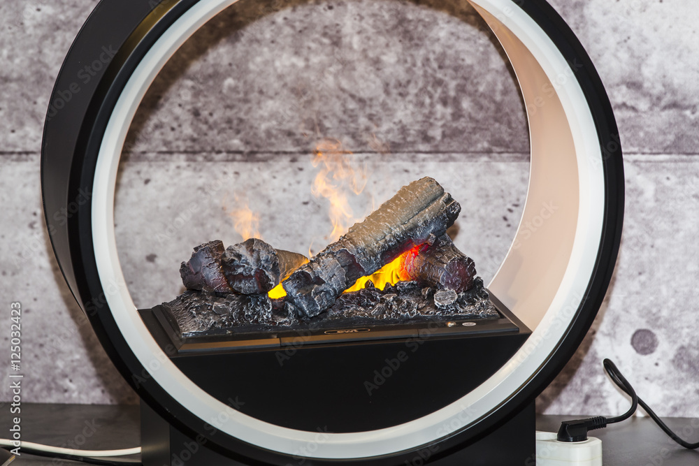 round electric fireplace with artificial sparkling flame, decor for the ...