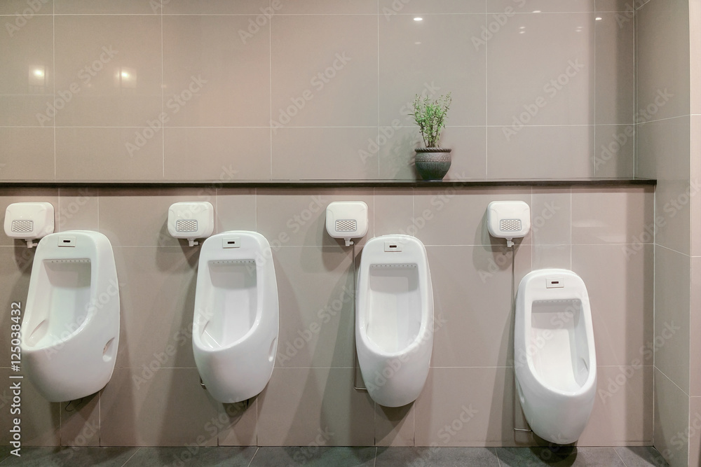 Public toilet / Empty urinals in public toilet for men only. Stock ...