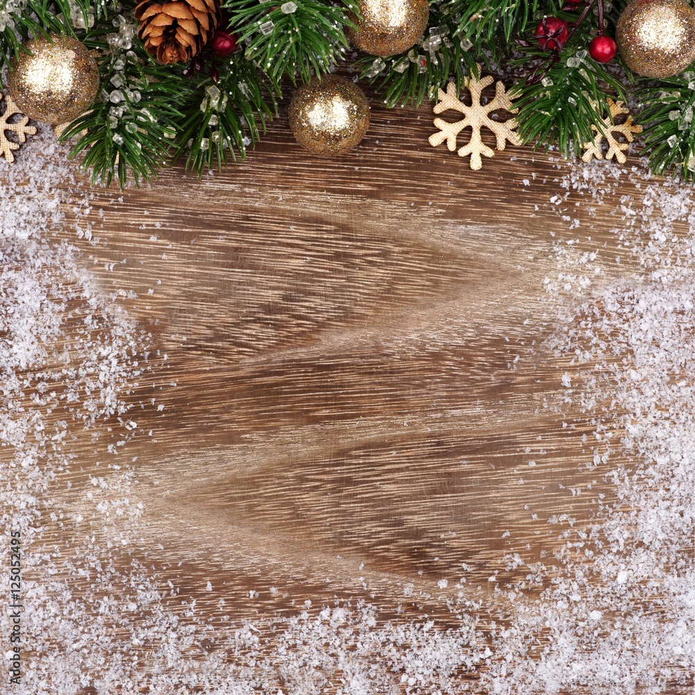Christmas top border with gold ornaments, branches and snow frame on a ...