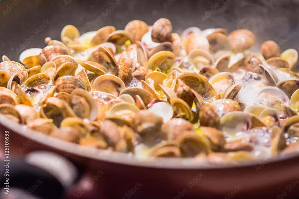 Cooking clams in a pan, Italian food tradition Stock Photo | Adobe Stock