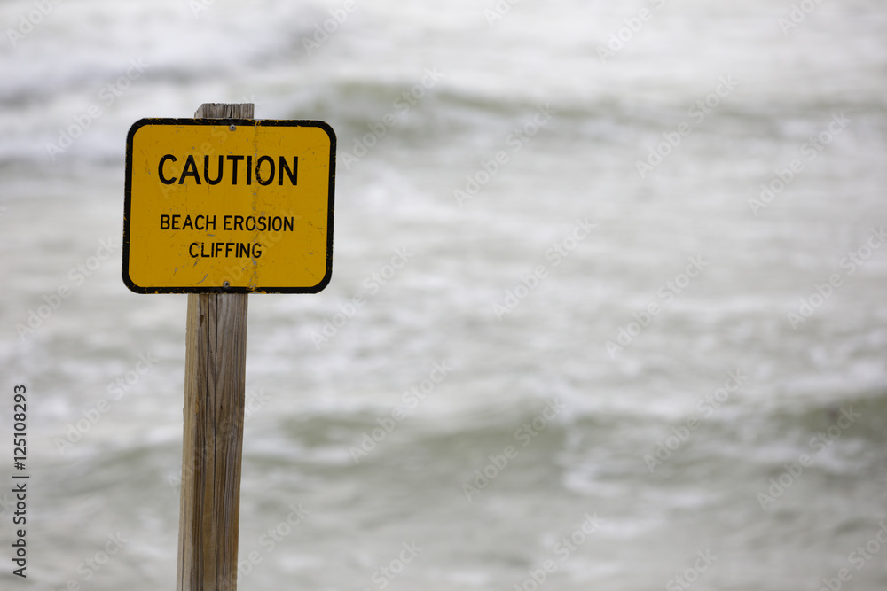 Warning sign on the beach erosion cliffing Stock Photo | Adobe Stock