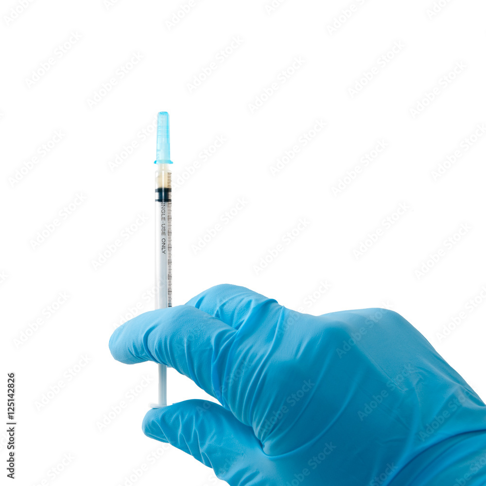 Hand holding syringe isolated on white. Stock Photo | Adobe Stock