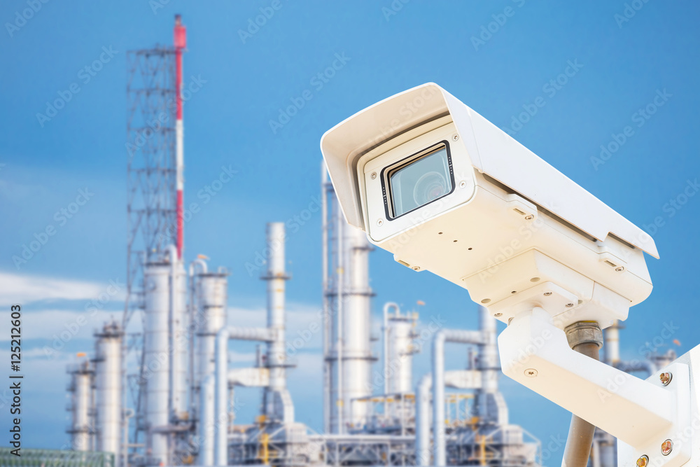 CCTV security camera on oil refinery distillation towers Stock Photo ...