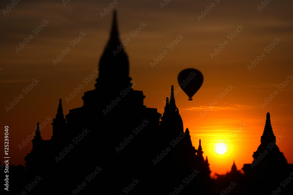 Ancient Buddhist Pagoda silhouette and balloon flying at amazing ...