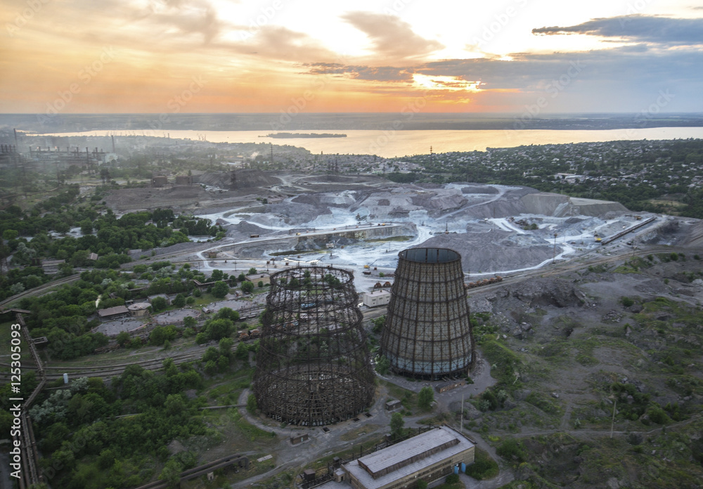 Industrial landscape in Ukraine. Steel factory with smog at sunset ...