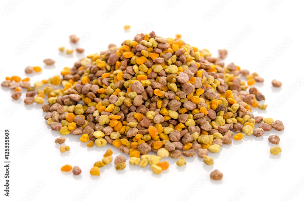 Bee pollen granules isolated on white Stock Photo | Adobe Stock