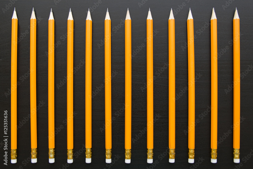 Row of identical pencils Stock Photo | Adobe Stock