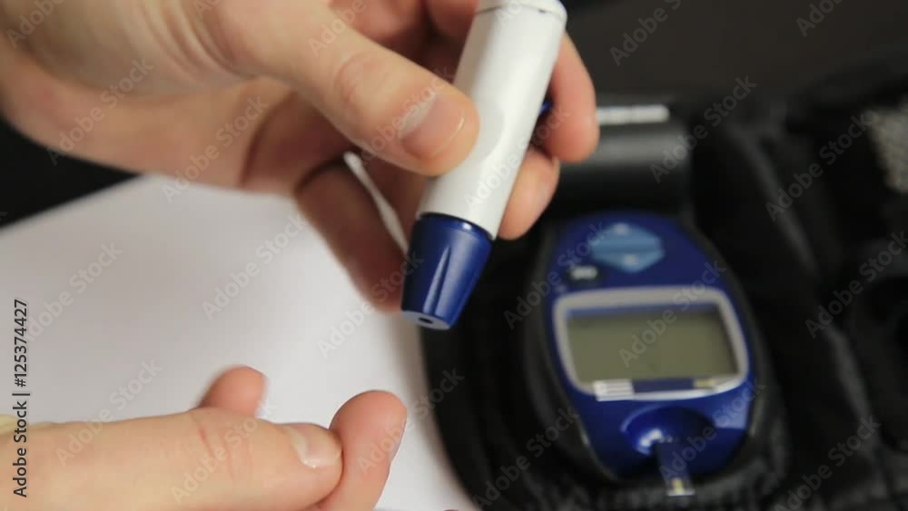 Measuring glucose level blood test using ultra mini glucometer and ...