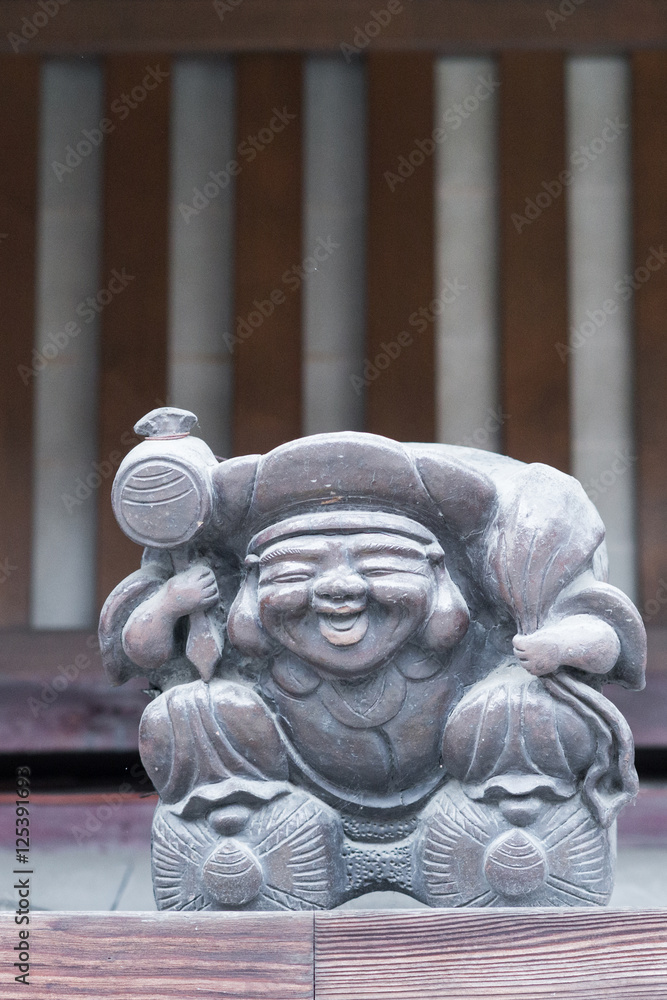 Takayama, Japan - September 24, 2016: Brown statue partly covered in ...