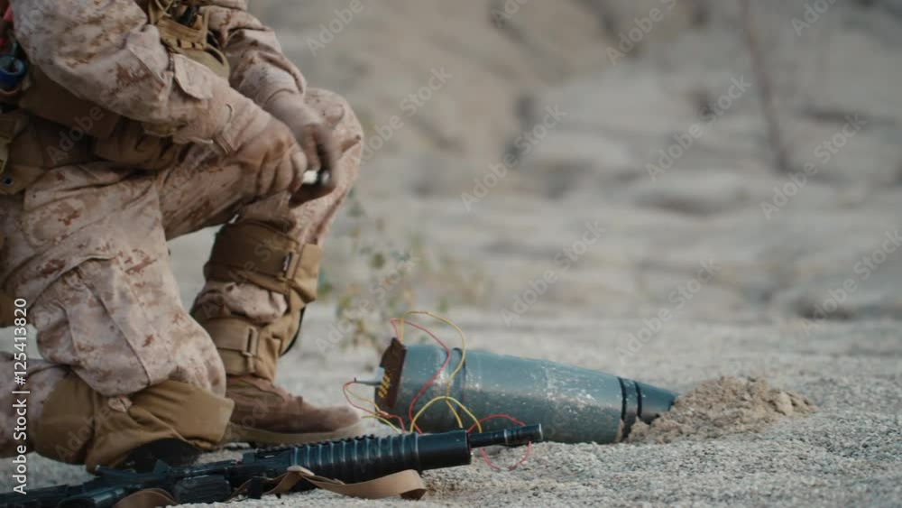 Soldier Defusing a Bomb by Cutting a Wire During Military Operation in ...