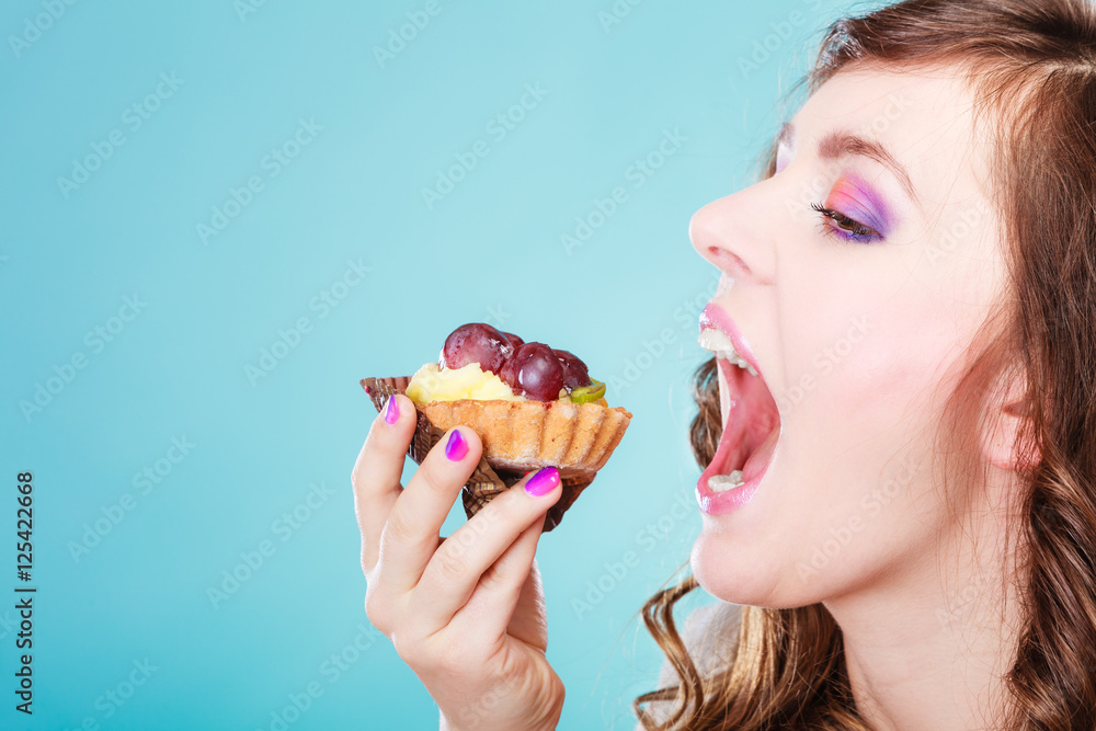 woman face profile open mouth eating cake Stock Photo | Adobe Stock