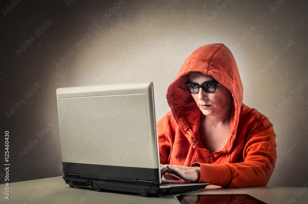 Nerd using a laptop Stock-Foto | Adobe Stock