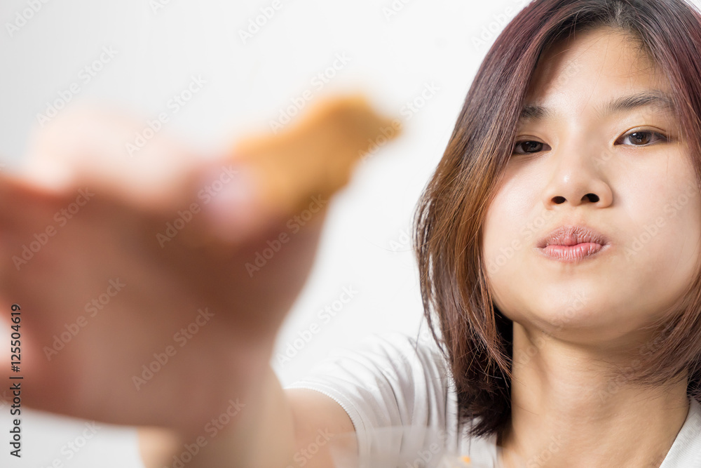 Cute Asian girl is using her hand to feed you a piece of cake. Japanese ...