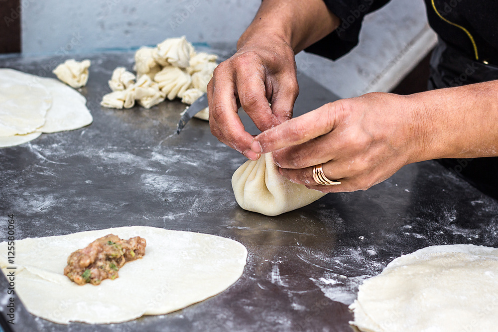 National Georgian cuisine Khinkali metal background Cook prepares ...
